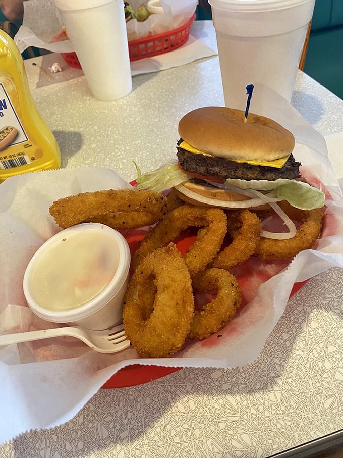 The classic burger-and-rings combo—where the onion rings form a golden fortress protecting a cheeseburger that means serious business.
