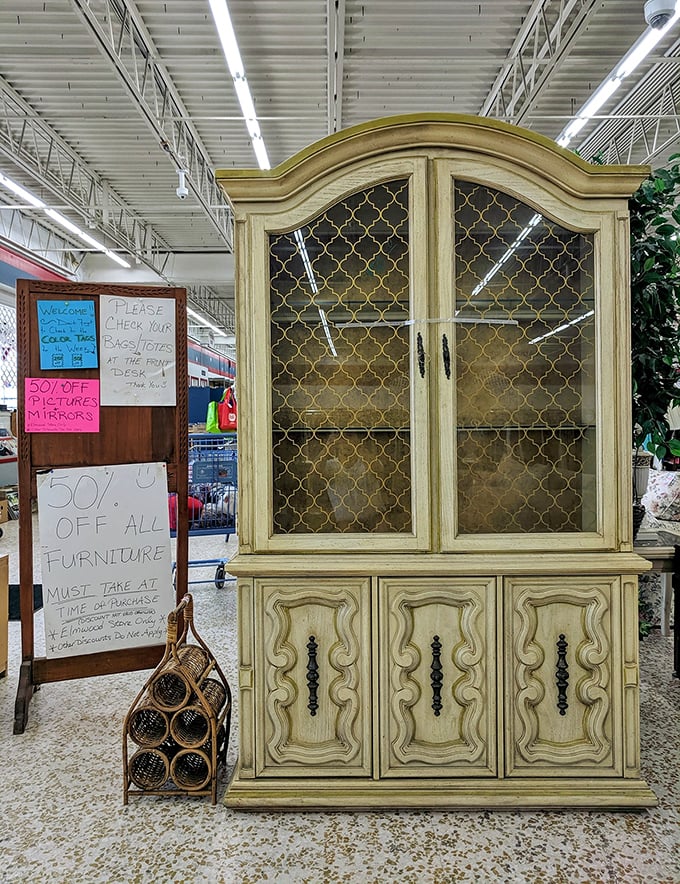 This elegant china cabinet isn't just furniture—it's architectural character for your dining room. Half the price, double the charm of anything new.