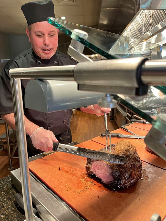 The carving station – where meat meets master. This prime rib is getting the VIP treatment it deserves before making its plate debut.