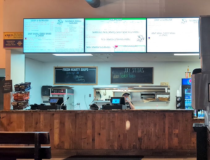 The ordering counter—where dreams are placed and hunger pangs go to die, all under the watchful glow of digital menu boards.