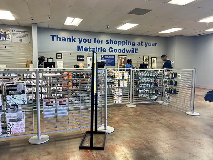 "Thank you for shopping at your Metairie Goodwill" – the checkout area reminds shoppers of their connection to the community.