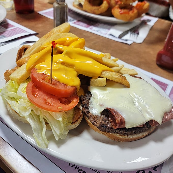 Cheeseburger architecture at its finest – that melty cheese cascade should be studied in culinary school. Fries looking equally spectacular.
