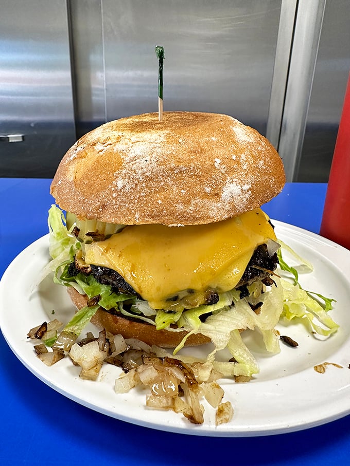 This isn't just a burger—it's a towering monument to hunger with a perfectly toasted bun and cheese melted with mathematical precision.