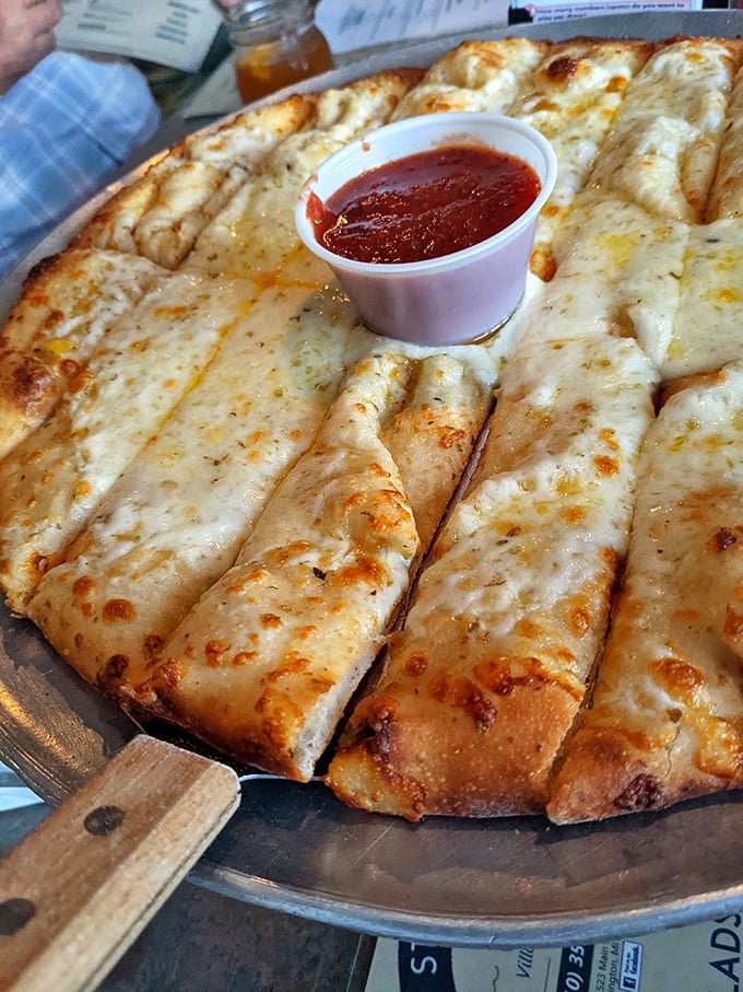 Their cheese pizza isn't just a meal—it's a canvas of melty perfection with marinara on the side for artistic dipping.