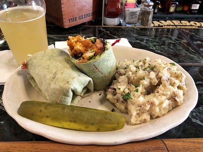 The wrap that launched a thousand lunch breaks – portable perfection with a pickle spear standing guard.