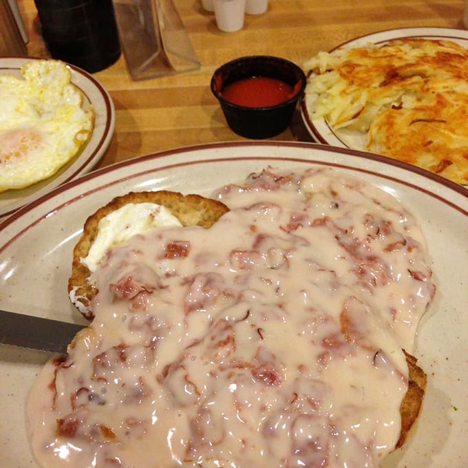 Biscuits smothered in creamy chipped beef gravy—a dish that proves comfort food doesn't need to be photogenic to be absolutely magnificent.