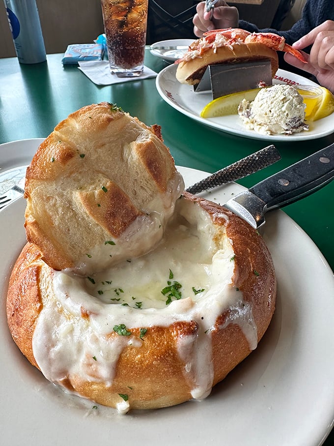 This isn't just clam chowder—it's a bread bowl of New England comfort, creamy enough to make you forget whatever diet you're cheating on.
