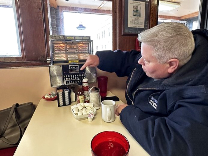 Remember when every table had a jukebox? This booth keeps the tradition alive and swinging.