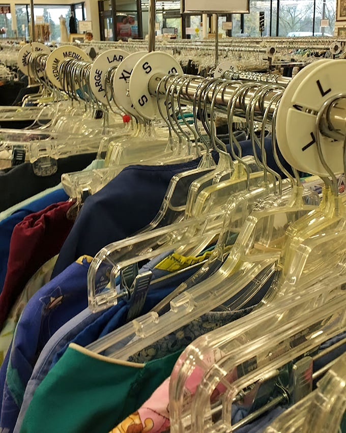 Size-sorted clothing racks with clear markers – the organizational system that separates the amateur thrift stores from the professionals.