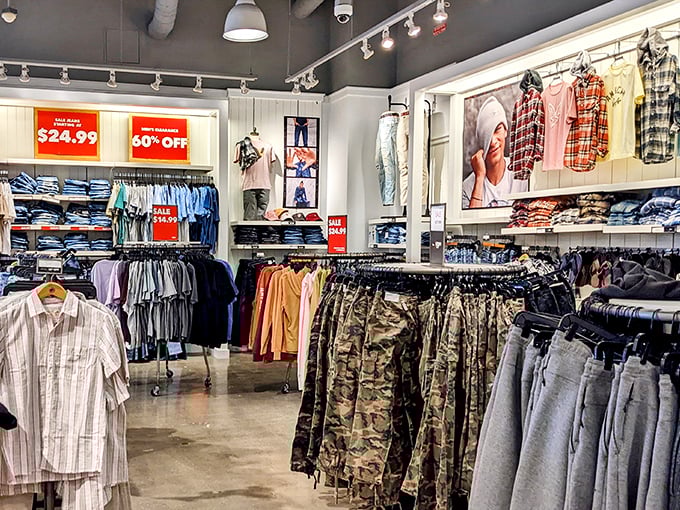 The men's department—where camouflage pants and plaid shirts wait patiently to become the uniform of dads at weekend barbecues nationwide.