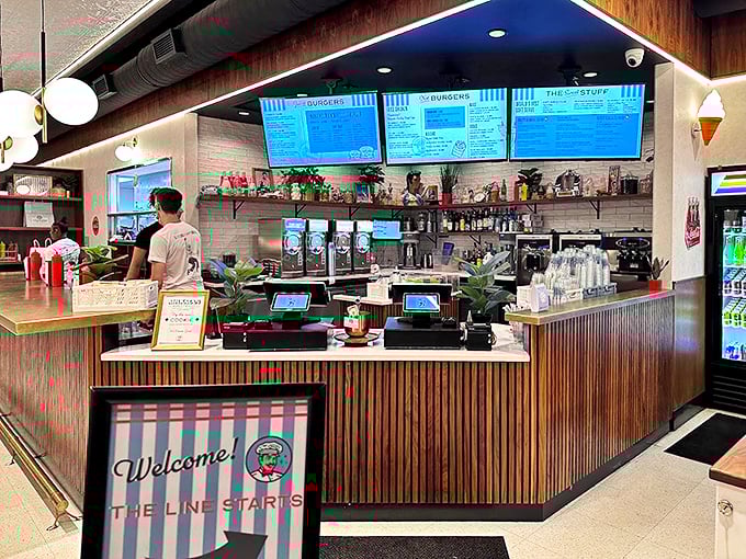 The ordering counter—where dreams become reality and the staff stands ready to guide you through Milkman's menu of temptations.