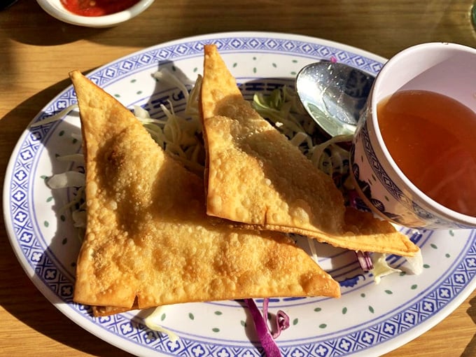 Crispy crab rangoon triangles standing at attention, ready to be dunked into that sweet and sour sauce they're clearly meant for.