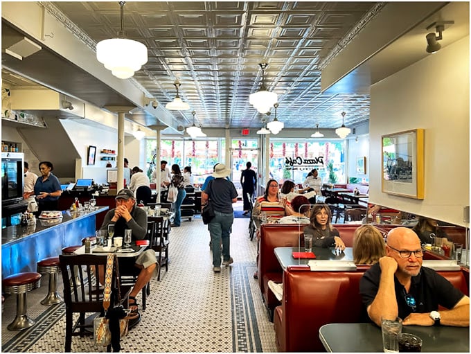 The dining room hums with the symphony of clinking silverware and conversation—a timeless scene from America's diner playbook.