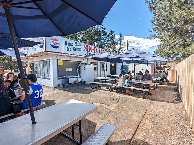Sun-drenched outdoor seating where the mountain air makes everything taste better—especially when "everything" includes old-fashioned burgers and shakes.