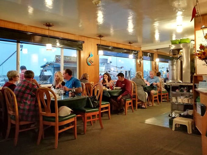 Diners enjoying the simple pleasure of fresh seafood and good company – a scene that hasn't changed much since humans first gathered around fires to eat.