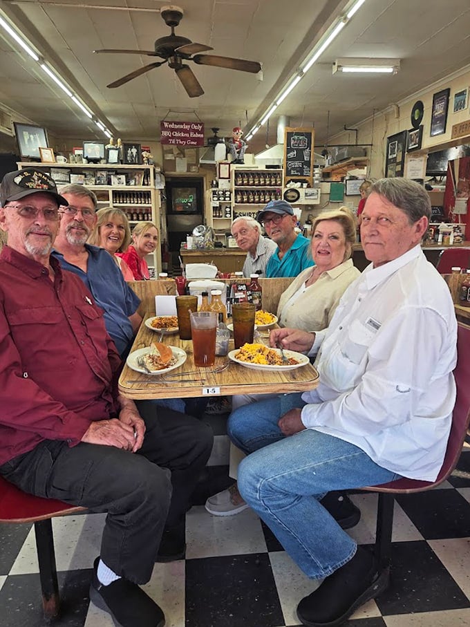 A table of friends sharing the universal joy of McClard's. Notice how nobody's looking at their phones—that's the power of proper barbecue.