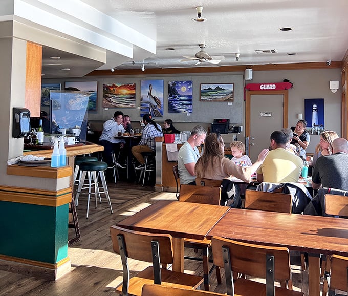 Local artwork adorns the walls while diners enjoy the real masterpiece – fresh seafood served with a side of Pacific Ocean views.