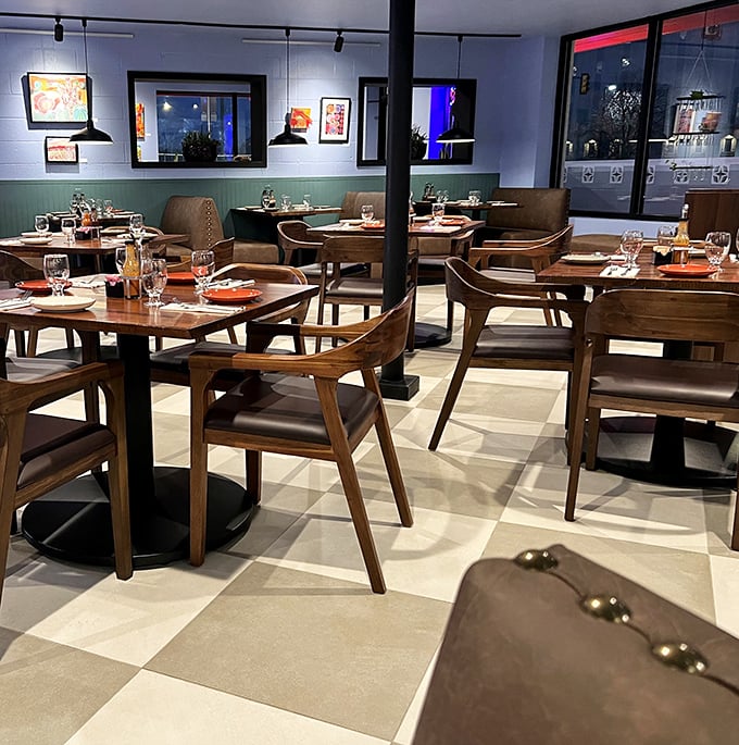 Wooden chairs and checkered floors create a dining room that feels both contemporary and timeless—like comfort food reimagined for today.