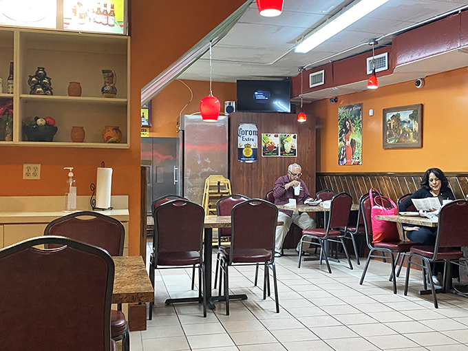 Another view of the dining room reveals the restaurant's homey charm – where red pendant lights cast a warm glow over satisfied diners.