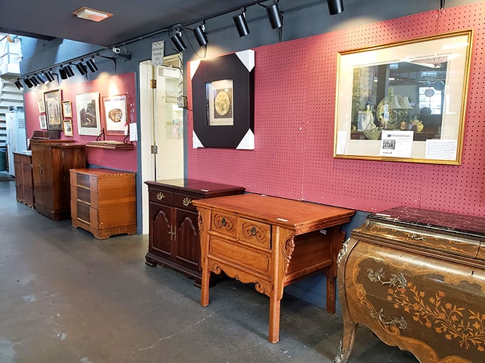 A gallery of wooden craftsmanship against a pop of pink—these aren't just dressers and cabinets, they're heirlooms-in-waiting.