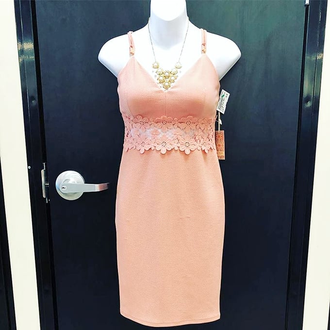 This peachy dress with original tags still attached is the holy grail of secondhand shopping – never worn but significantly marked down.