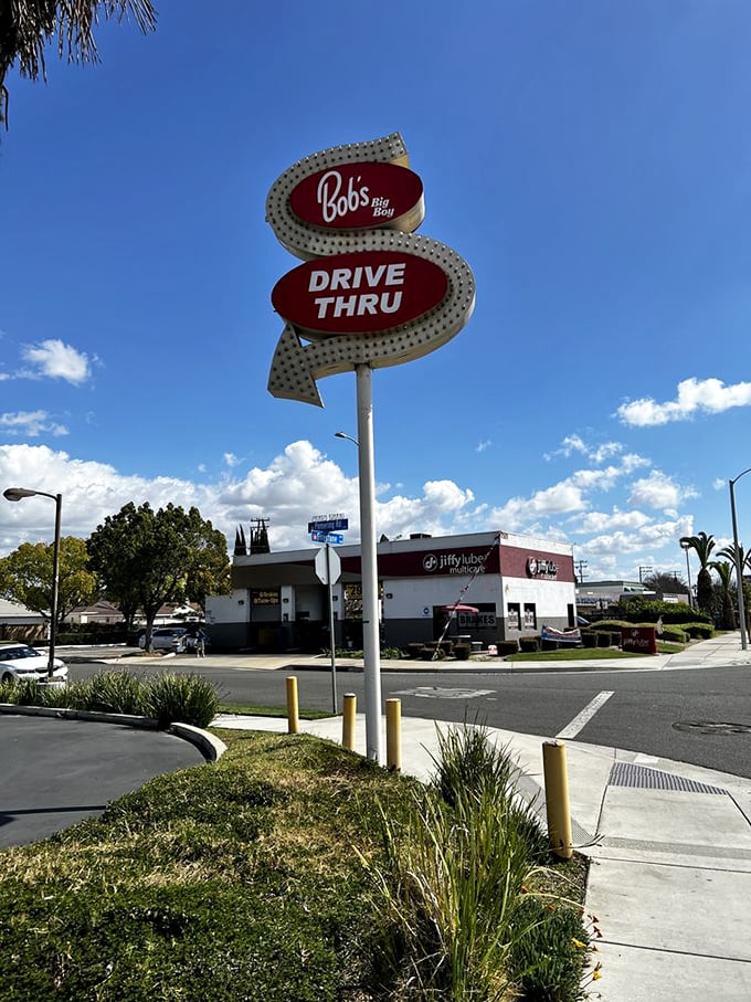 This isn't just a drive-thru sign—it's a promise that good things come to those who don't want to leave their car.