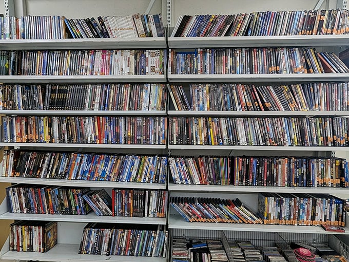 DVD shelves packed with cinematic adventures prove physical media isn't dead—it's just moved to a more affordable neighborhood.