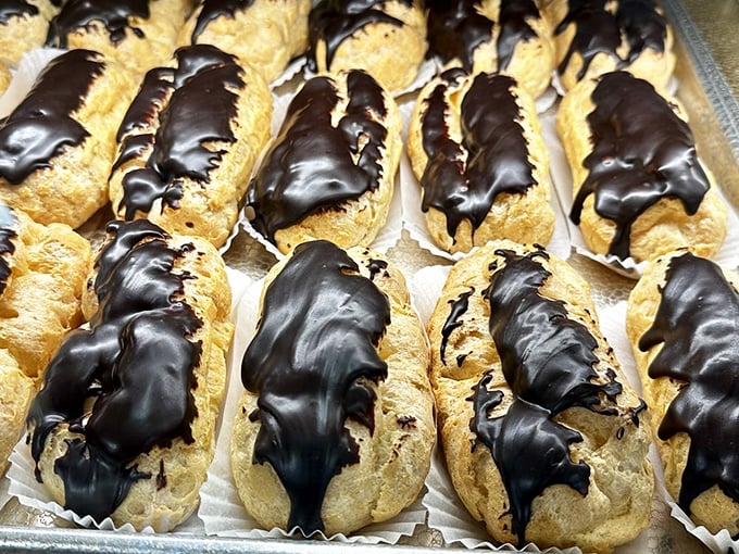 Chocolate-dipped éclairs lined up like soldiers in a delicious army ready to wage war on your willpower—and win decisively.