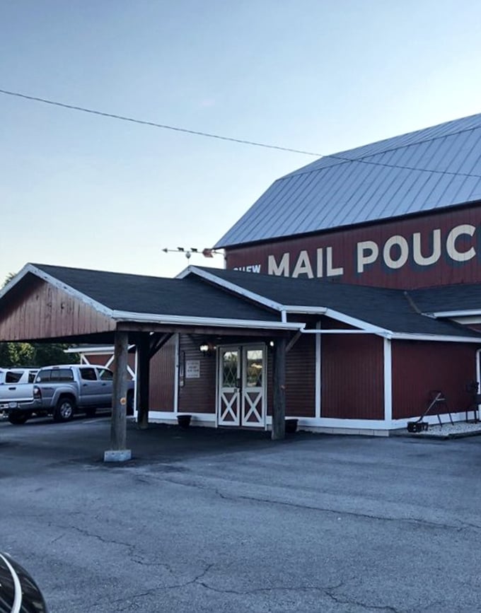 The entrance beckons with its barn-red siding and white trim—architectural shorthand for "good, honest food served without pretension awaits within."
