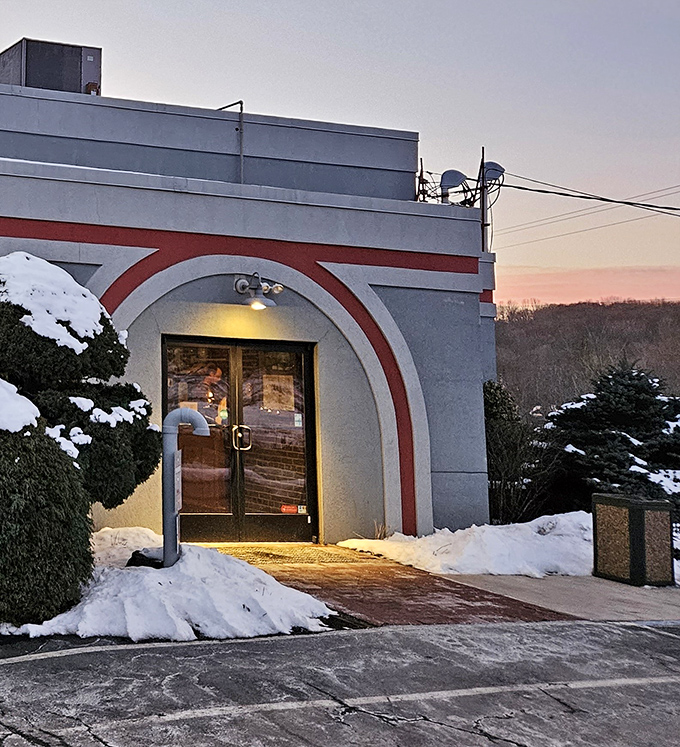 Winter's chill makes the warm glow behind these doors even more inviting—a snow-framed entrance to comfort food paradise.