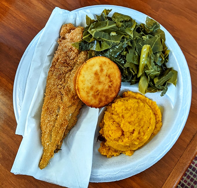 Cornmeal-crusted fish, golden cornbread, and collards that taste like they've been simmering since Sunday. This is edible poetry.