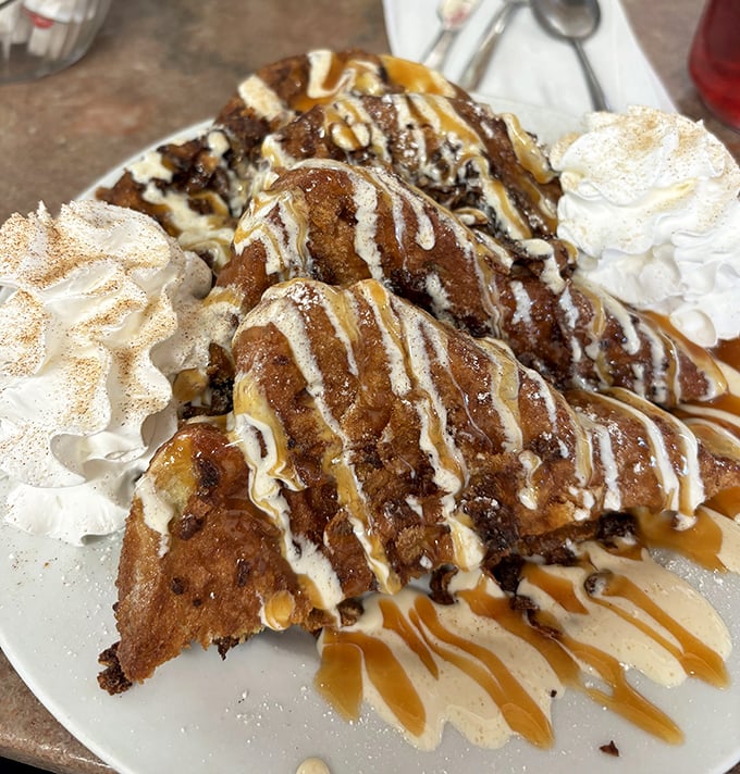 This isn't just French toast—it's a caramel-drizzled, whipped-cream-crowned monument to morning decadence that makes "breakfast dessert" sound perfectly reasonable.