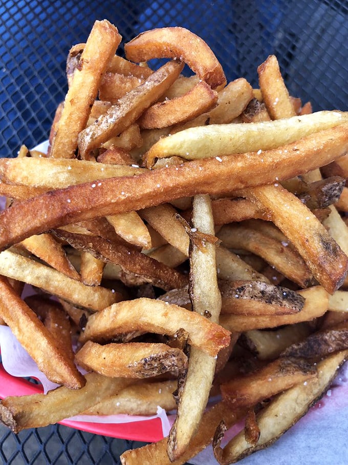 These fries aren't just fried – they're fulfilling their potato destiny with a golden crispness that makes the perfect audible crunch with each bite.
