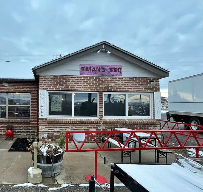 Even in winter, that pink B-Man's sign cuts through the gray sky like a beacon of warm, smoky hope for hungry travelers.