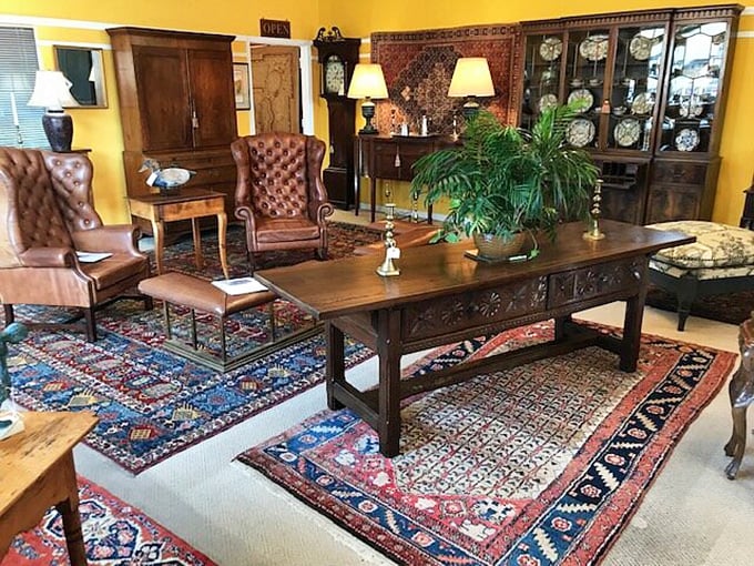 This living room setup isn't just furniture—it's a stage where life happens. Those leather chairs have "sit here and tell me your troubles" written all over them.