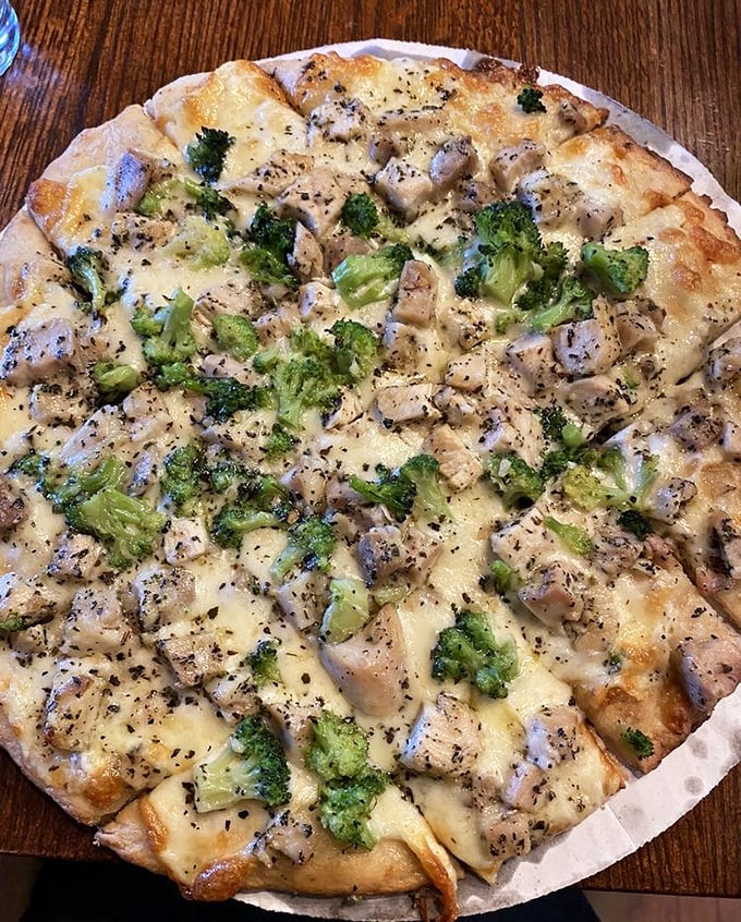 Chicken and broccoli living in perfect harmony on a pizza canvas—a delicious reminder that healthy-ish can still be heavenly.