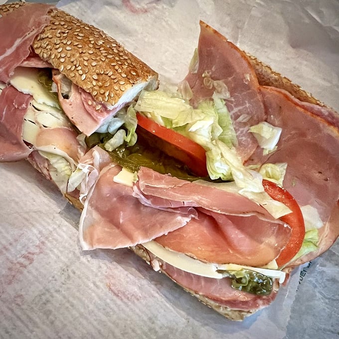 This isn't just a sandwich—it's architectural genius. Layers of Italian meats, cheese, and veggies on a sesame-studded roll that deserves its own zip code.