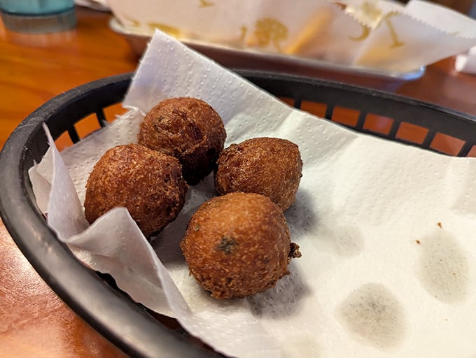 Hushpuppies so perfectly golden they deserve their own trophy. Crispy outside, fluffy inside—the unsung heroes of the seafood feast.