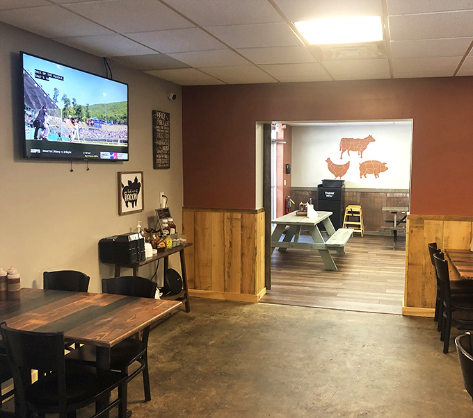 The wooden wainscoting and meat-cut diagrams create that perfect BBQ joint atmosphere—educational and appetizing all at once.