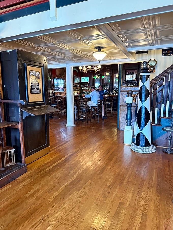The bar area doesn't just serve drinks—it serves as the community's living room where strangers become friends over local brews.