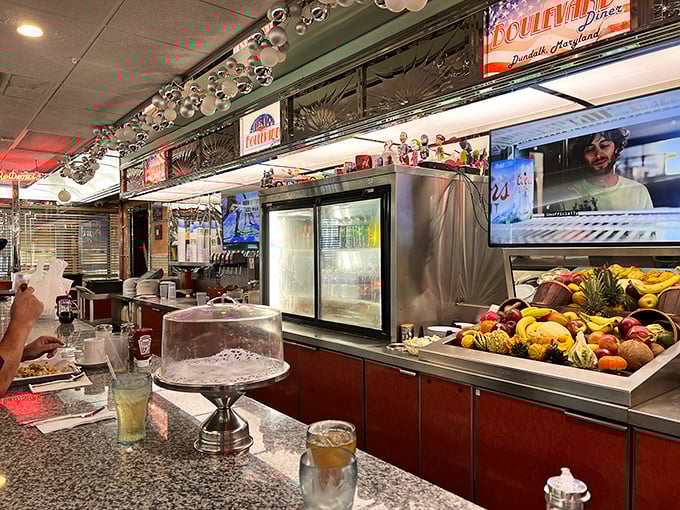 The dessert display case and counter—where willpower goes to die and where "I'll just have coffee" turns into "Well, maybe just a slice of pie."