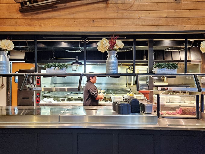 A glimpse into the kitchen battlefield where culinary magic happens—spotless stainless steel and focused chefs turning raw ingredients into memories.