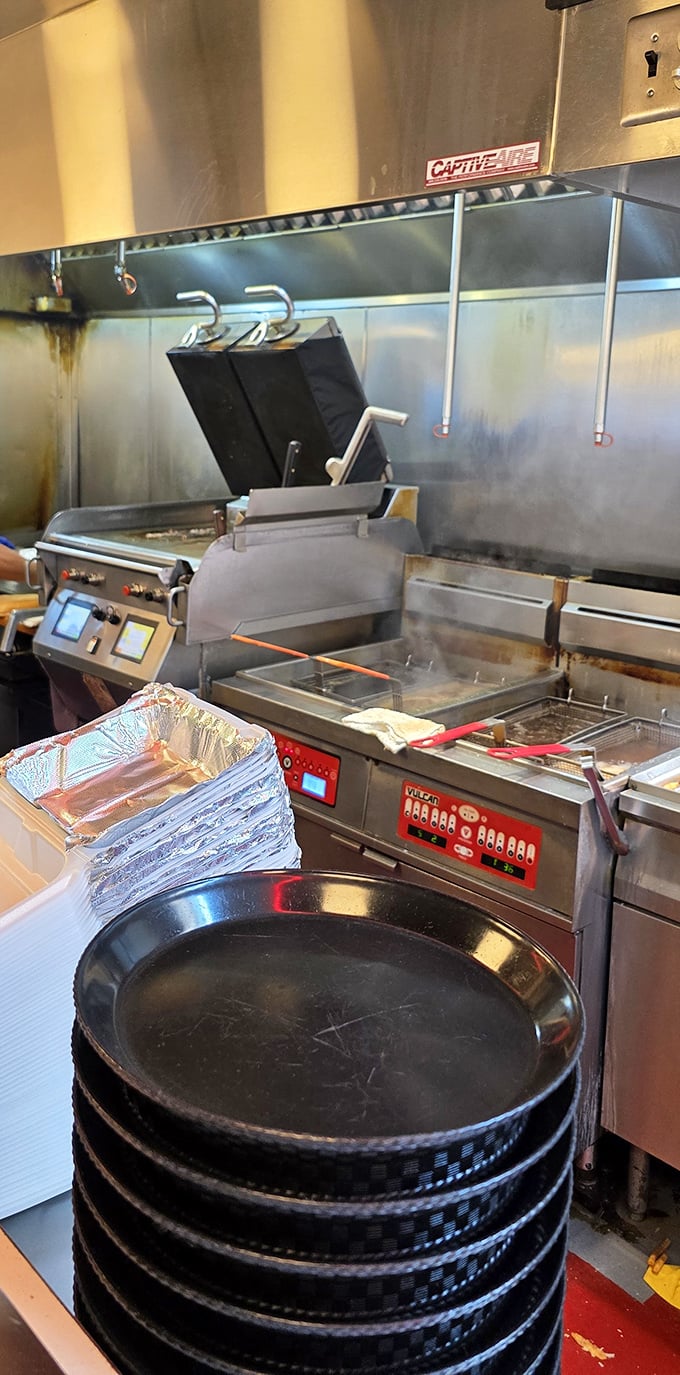 The kitchen battlefield where cheesesteak magic happens. Those aren't just cooking tools—they're instruments of joy.