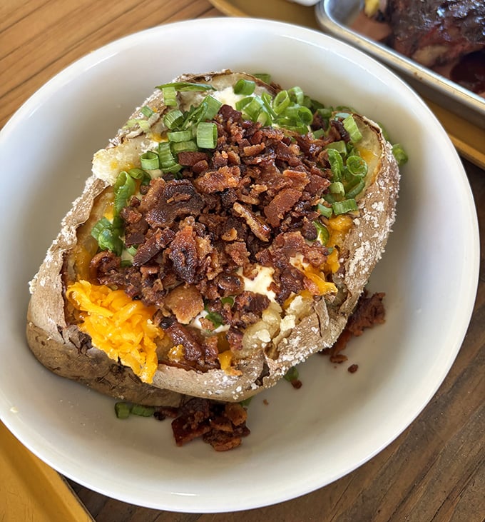 A loaded baked potato that's dressed better than most people at the mall. Cheese, green onions, and bacon create a spud symphony.