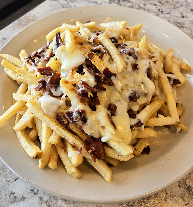 Loaded fries that require a commitment and possibly a nap afterward. Worth every calorie and minute of lost productivity.