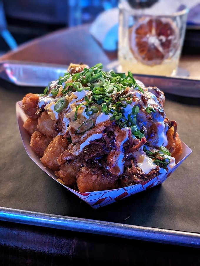 These loaded tots aren't just a side dish—they're a full-blown flavor festival topped with enough goodies to make a potato feel special.