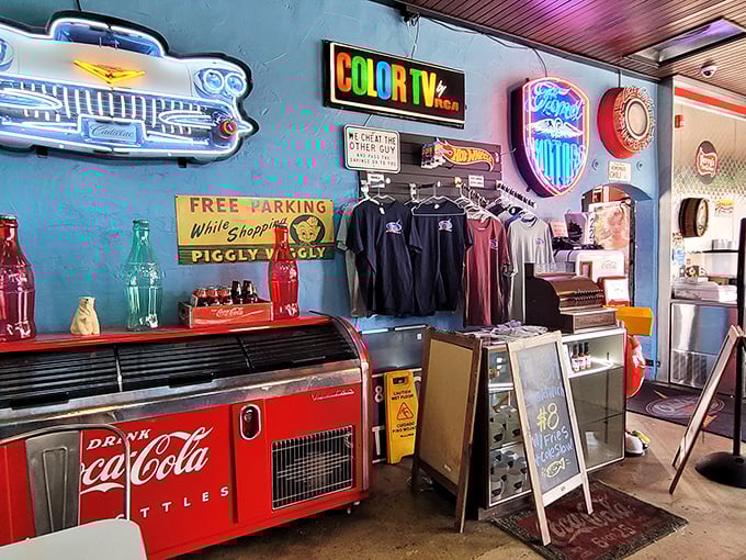 Vintage signs and Coca-Cola memorabilia create the backdrop for a retail corner where you can take a piece of nostalgia home.