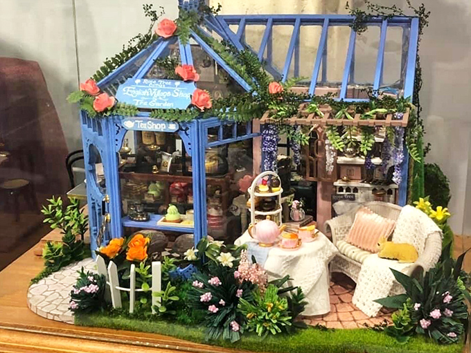 A whimsical blue garden tea shop where the roses never wilt and the scones are perpetually fresh—though admittedly a bit hard on the teeth.