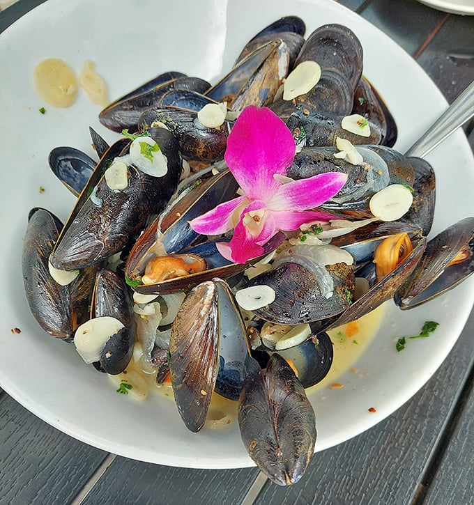 Mussels that look like jewelry – glistening shells open to reveal tender morsels, garnished with a touch of unexpected elegance.