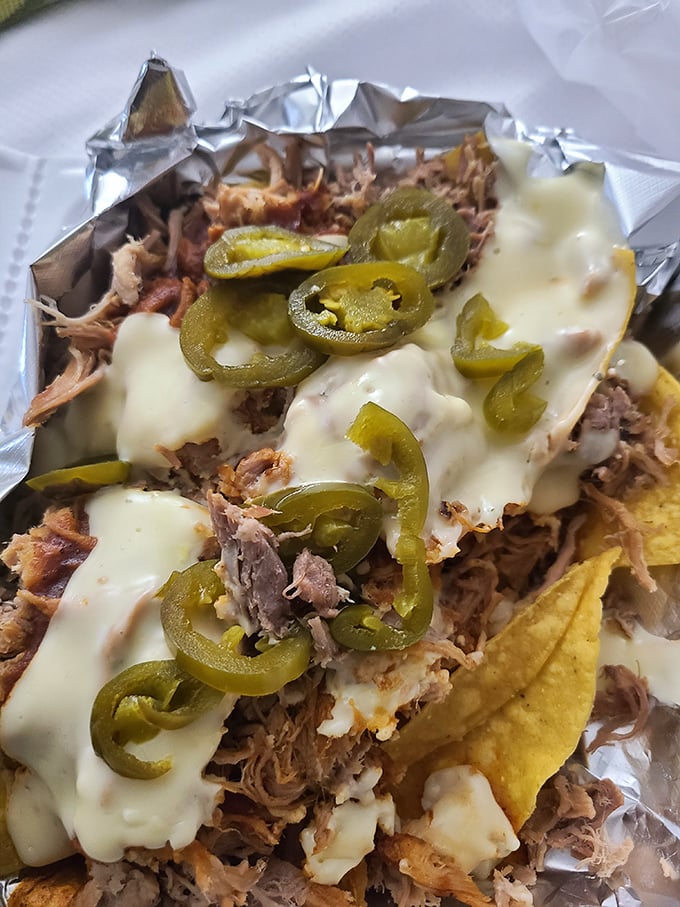 BBQ nachos—where Tex-Mex meets North Carolina in a glorious fusion that somehow makes perfect sense after the first bite.